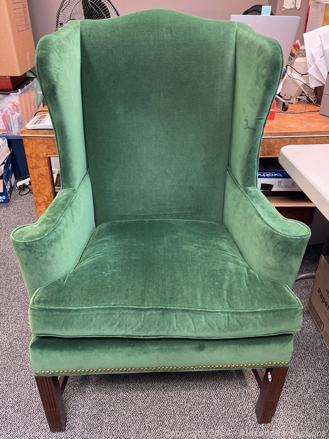 Nice dark green velvet wingback chair with nailhead trim
